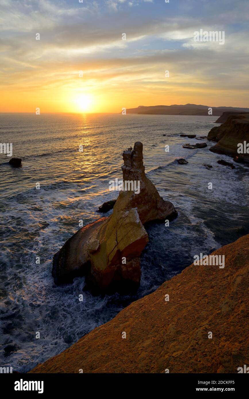 Sunset over the rock Catedral, Playa Supay, Paracas National Reserve ...