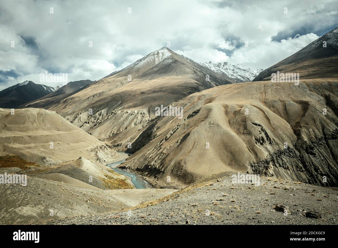 Barren plateau with the gorge of the Wachandarja, in the background the ...