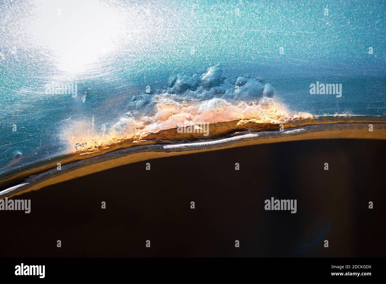 Detail of a rusty fender of a green car Stock Photo - Alamy