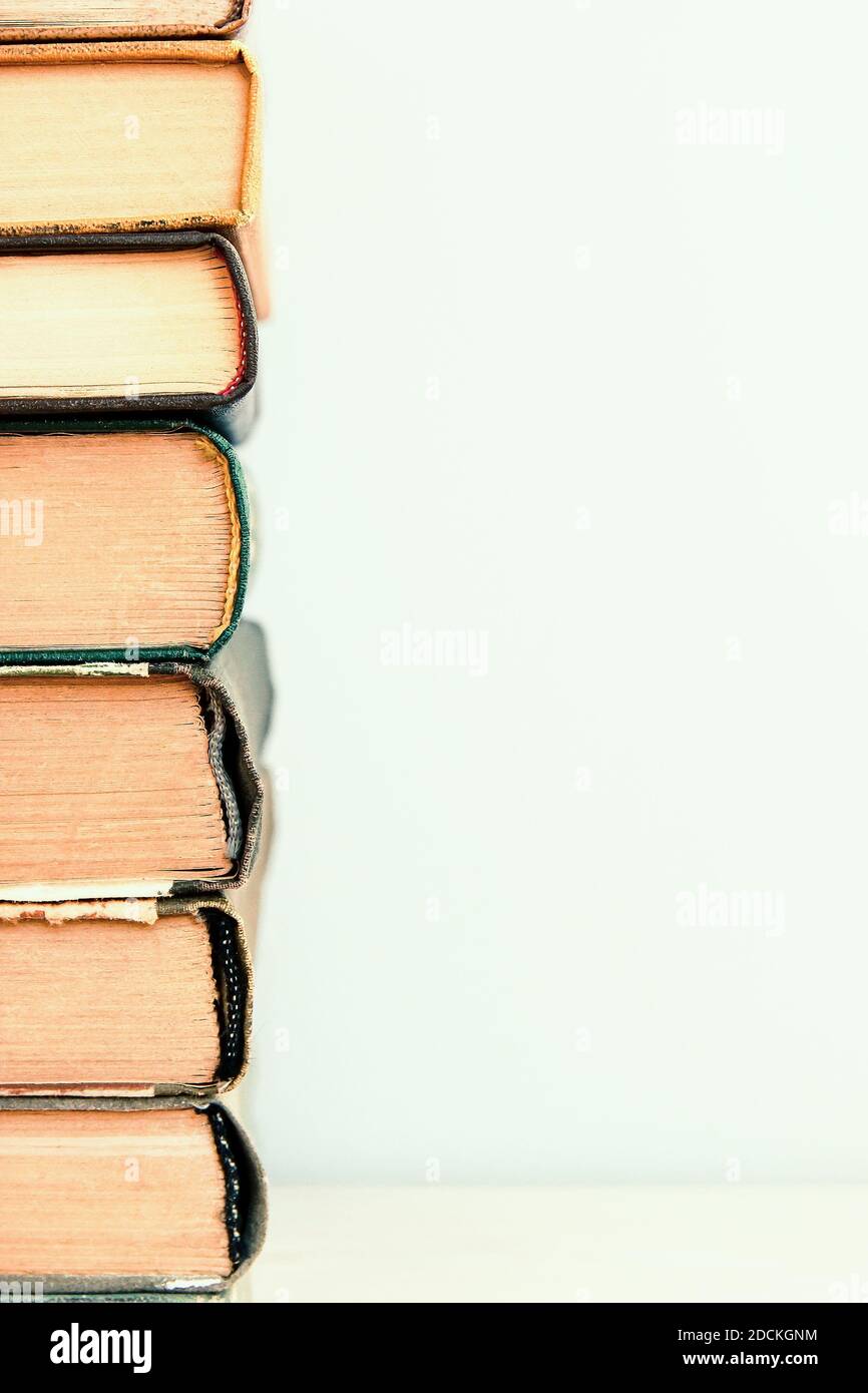 Stack of old used books background. Pile of vintage old hardback books ...