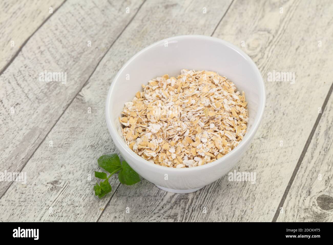 Raw oats in the bowl for breakfast Stock Photo - Alamy