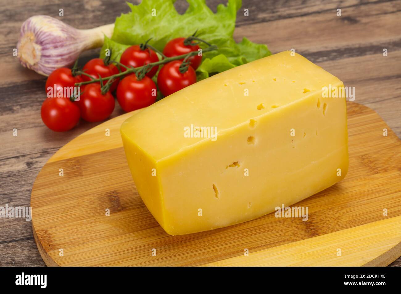 Swiss Hard yellow tasty cheese brick Stock Photo - Alamy