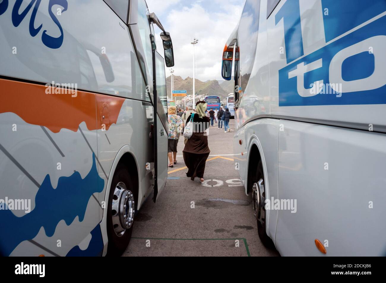 Two large tourist buses brought tourists on a tour and are parked ...