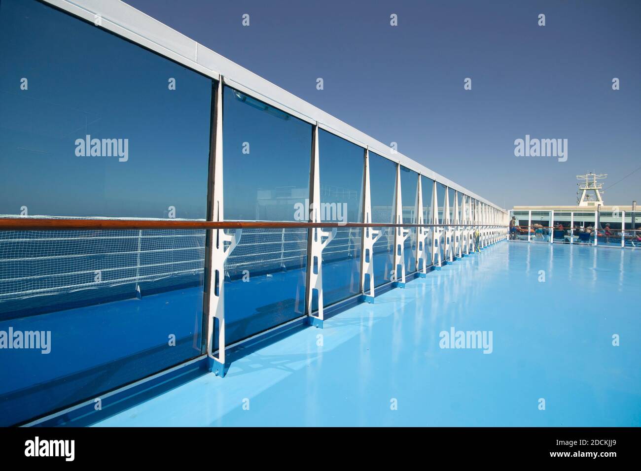 the deck of a ship in the summer sun. The fence in transparent panels ...