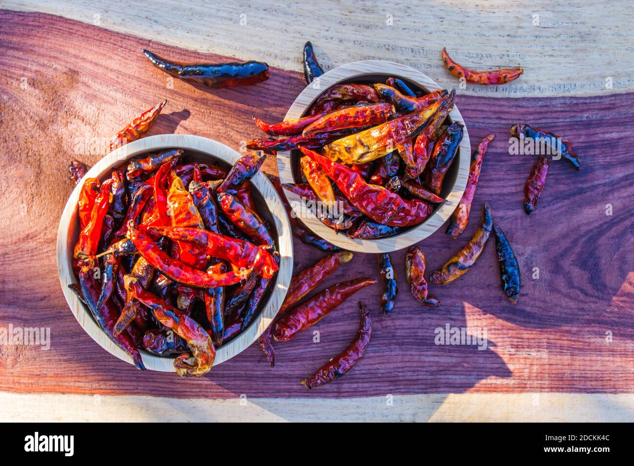 Chili burned in a wooden bowl and put on the table. Top view Stock ...