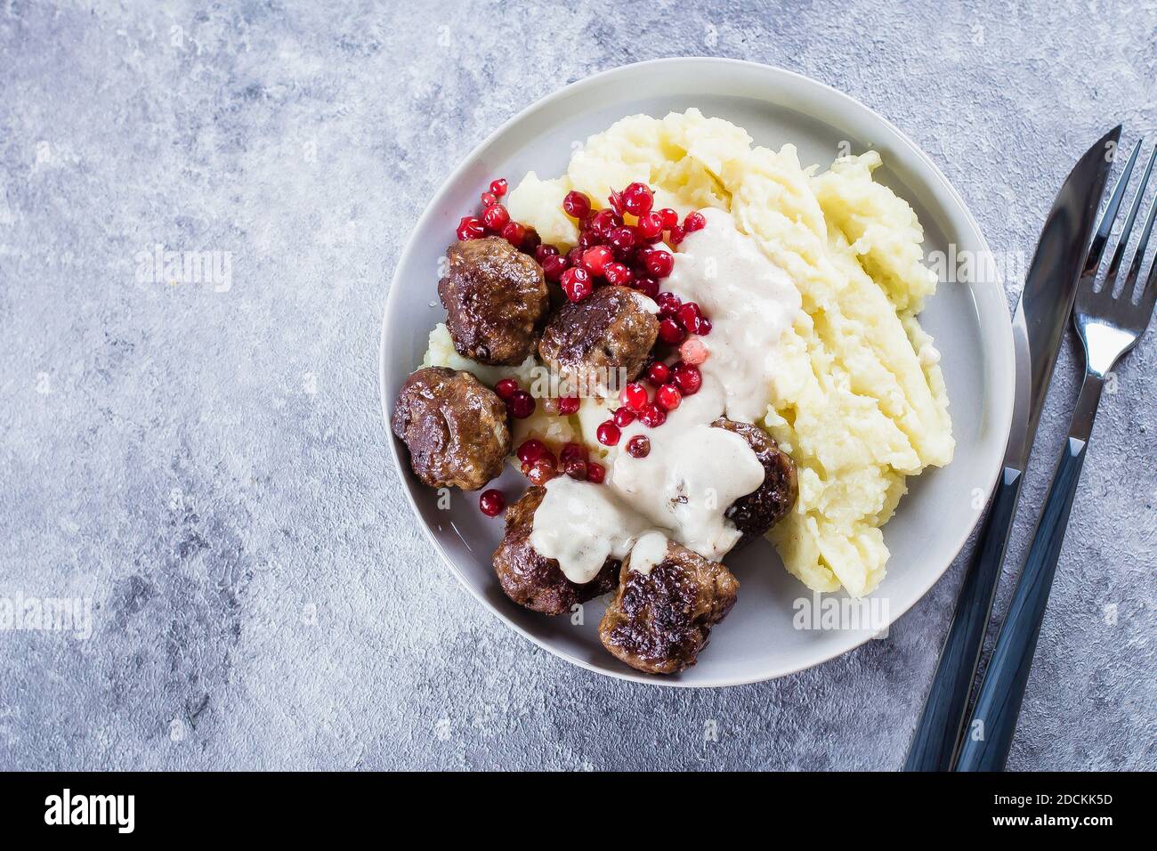 Homemade beef and pork meatballs with mashed potatoes and lingonberry ...