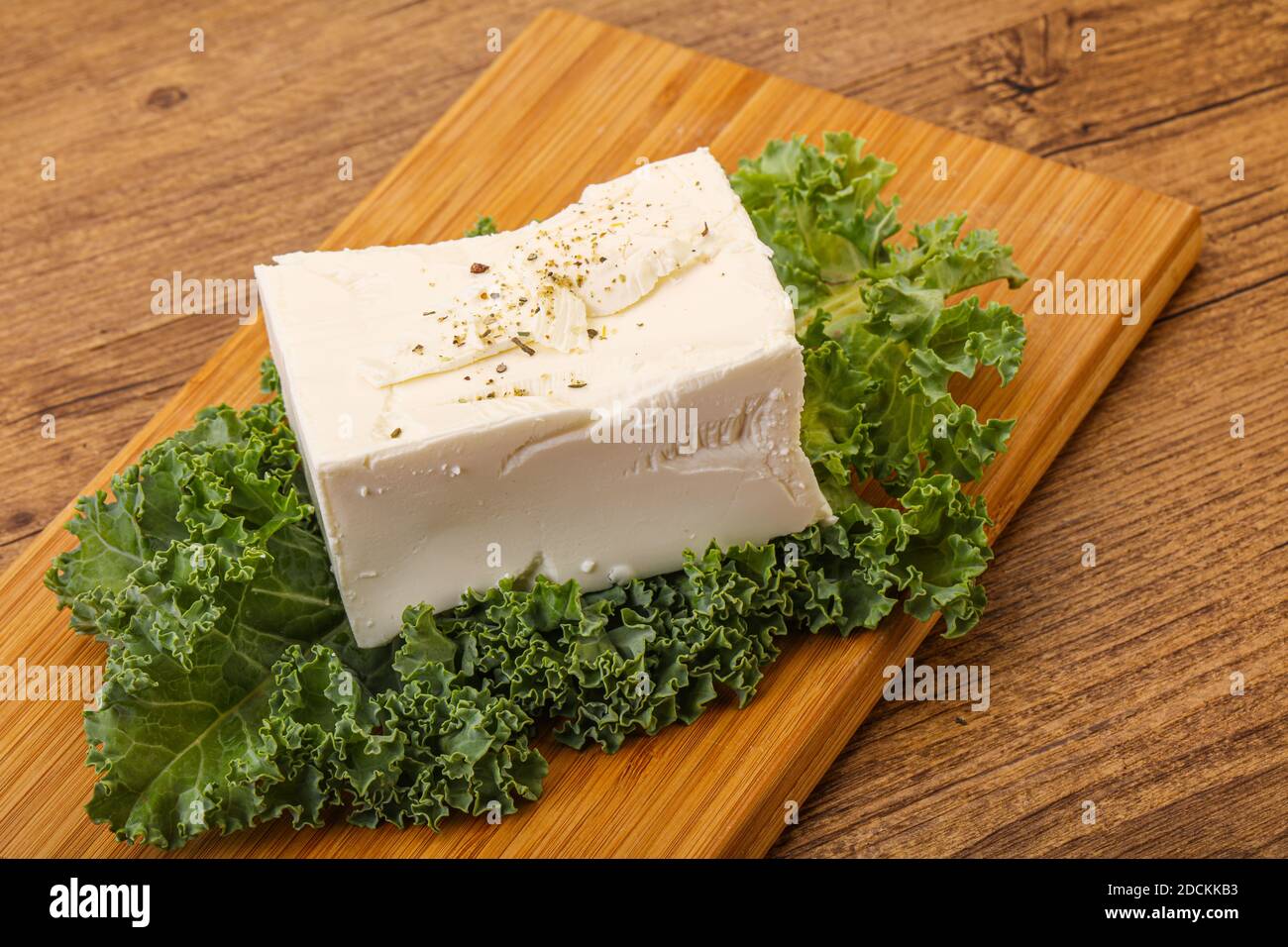 Traditional tasty Greek Feta soft cheese brick Stock Photo - Alamy