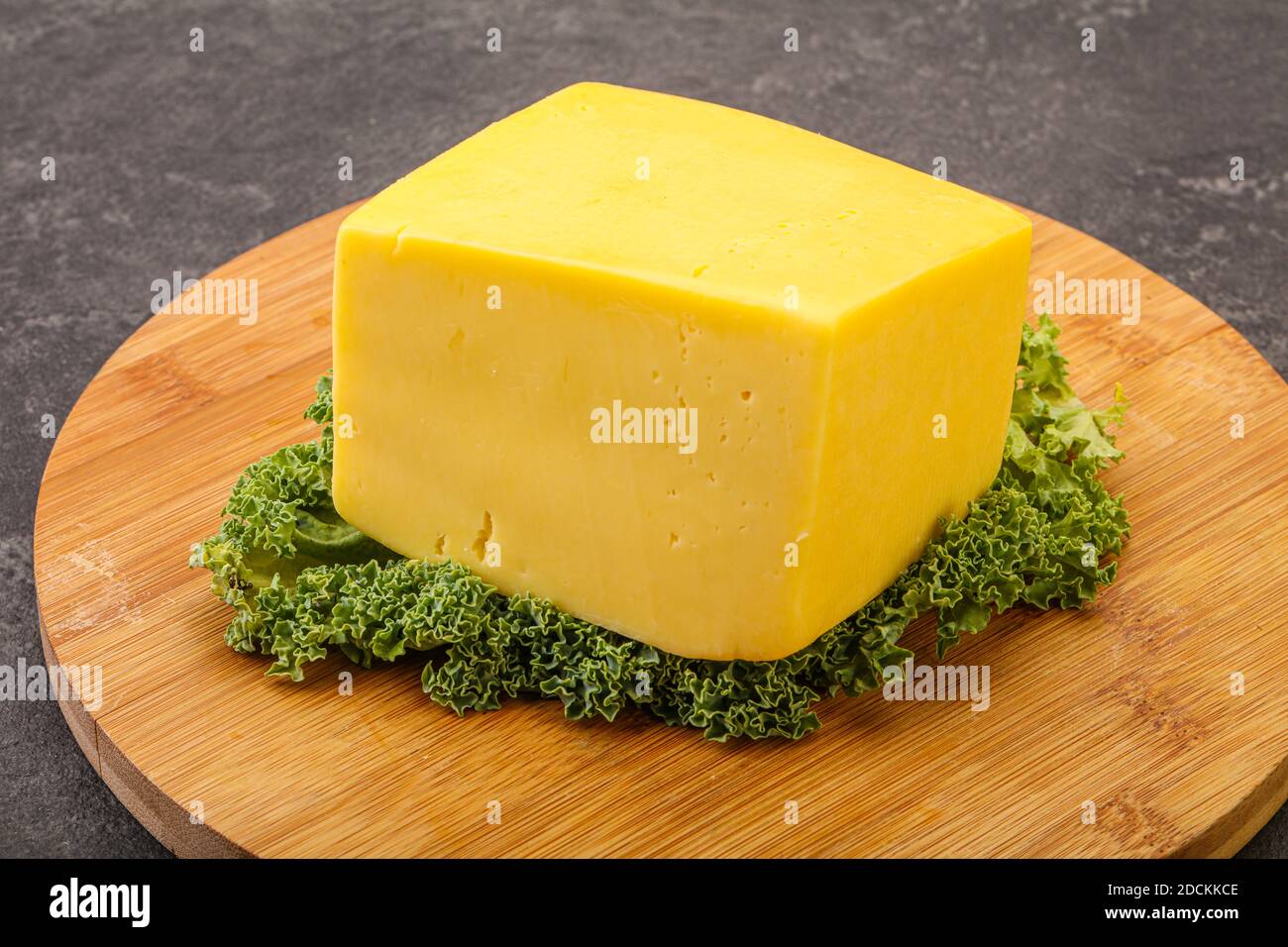 Yellow tilsiter cheese dairy product brick Stock Photo - Alamy