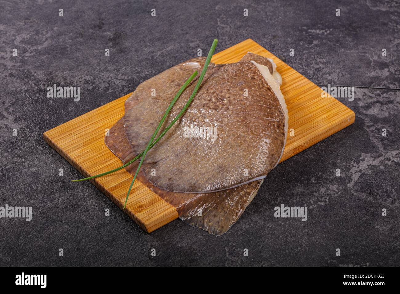 Raw stingray wings tasty fillet for cooking Stock Photo - Alamy