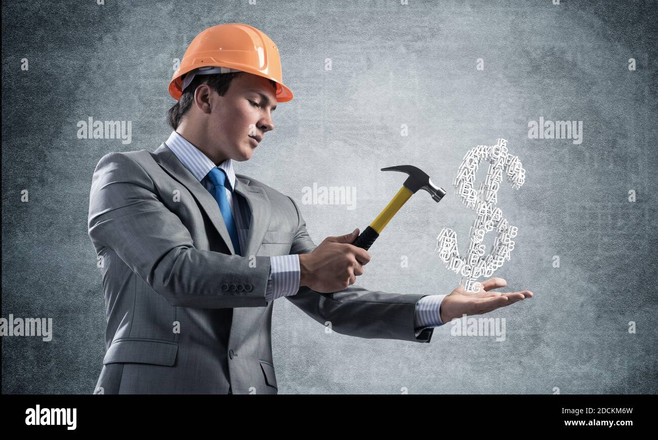 Businessman going to crash with hammer dollar Stock Photo - Alamy