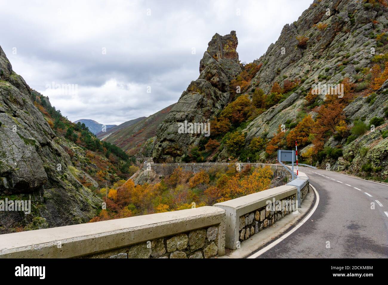 A narrow and curvy road in autum color mountain wilderness Stock Photo ...