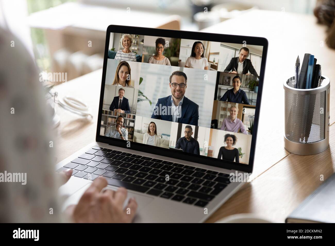 Back view of employee talk on video call with colleagues Stock Photo ...