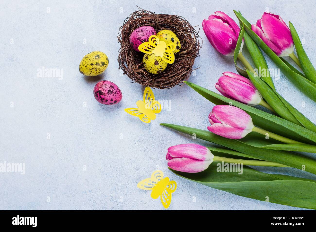 Spring Easter Greeting Card. Pink tulips and colorful quail eggs in ...