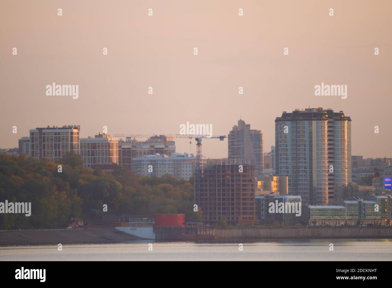 View on a small city by the river Stock Photo - Alamy