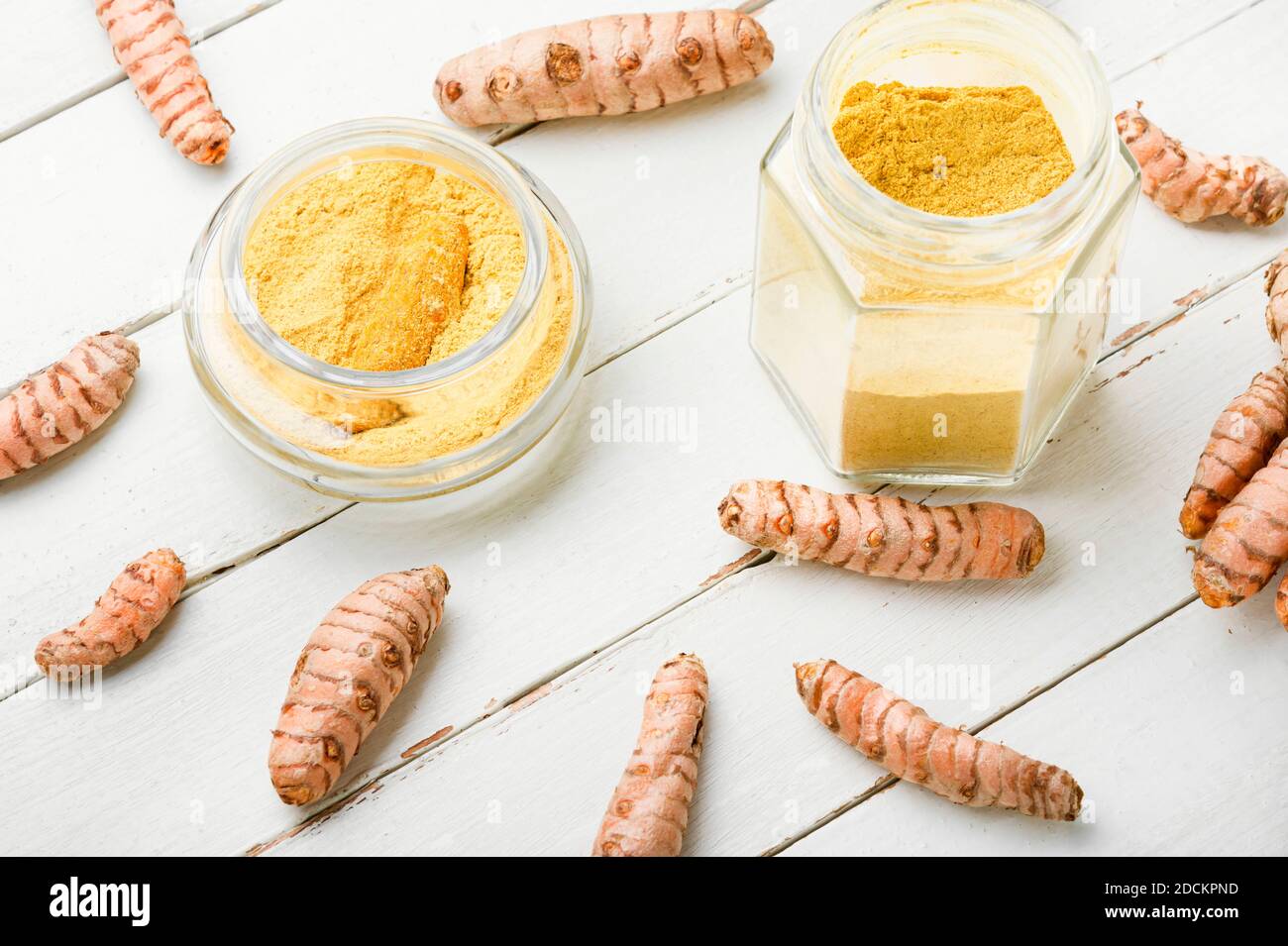 Fresh turmeric root or rhizome and turmeric powder Stock Photo - Alamy