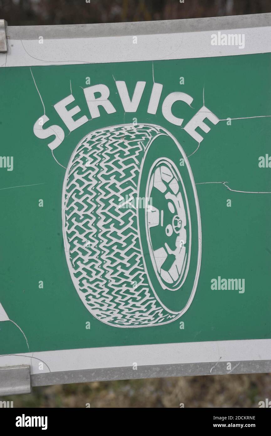green car tires service sign on the street, with white pictogram Stock ...