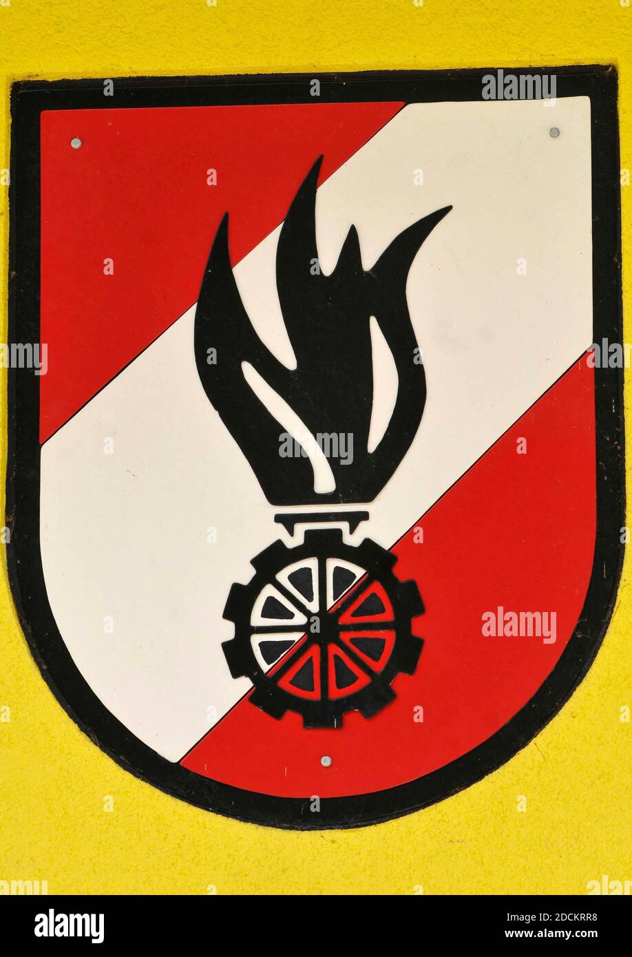 red and white fire department sign, with wheel and flame Stock Photo ...