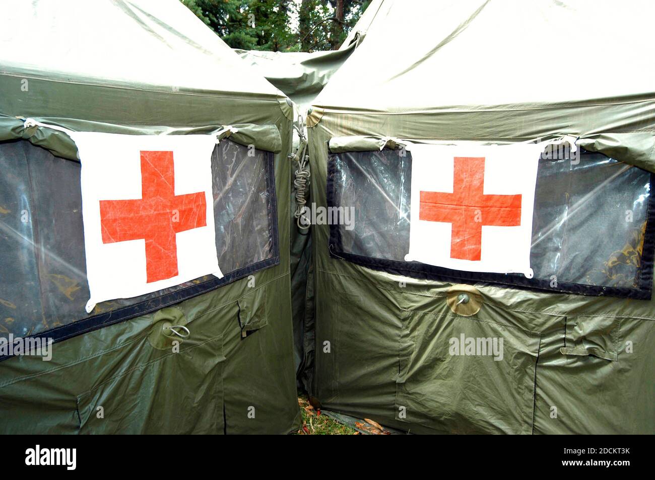 military hospital in the field, green tents with red cross symbol Stock ...