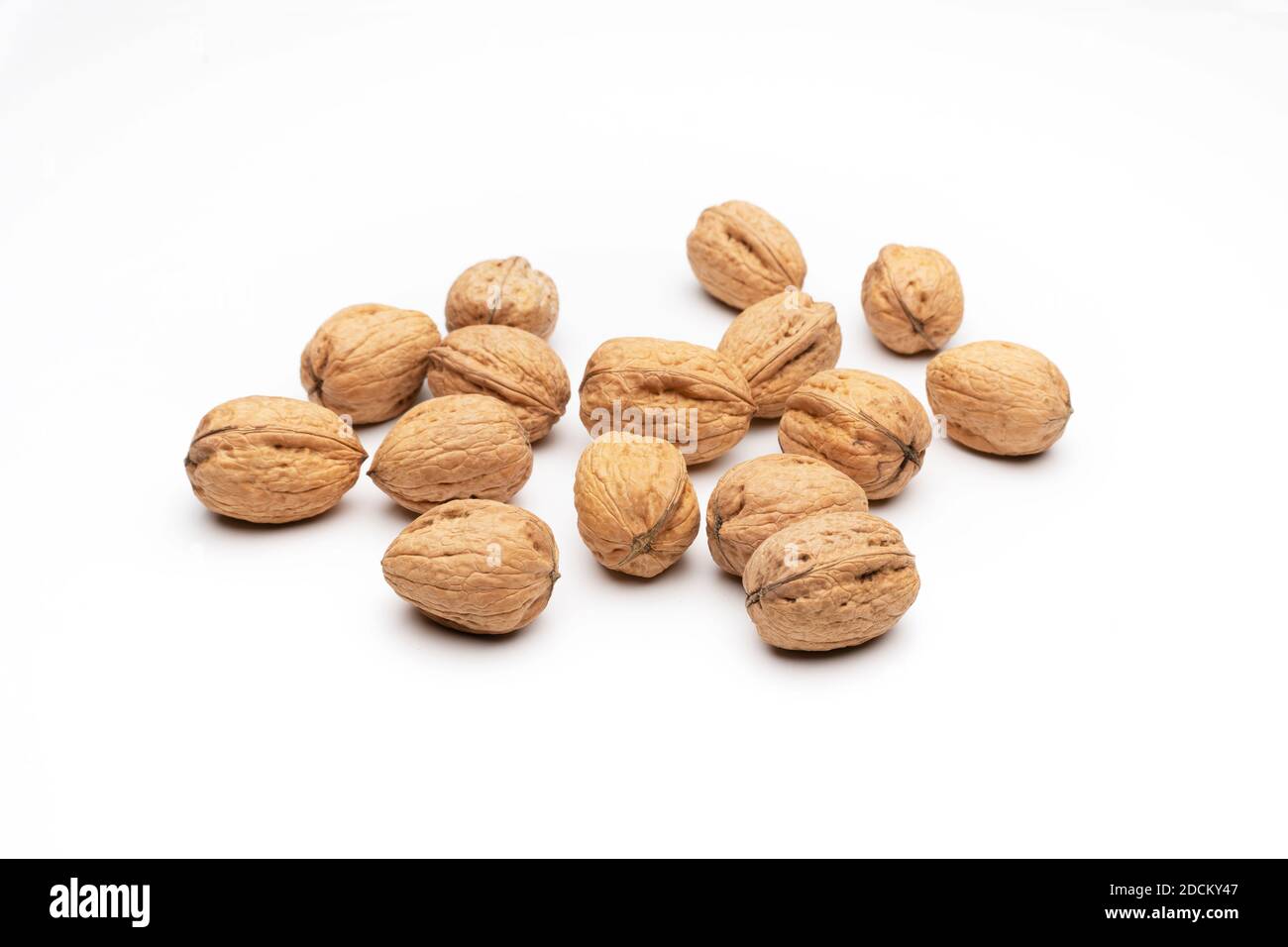 Various walnuts on white background Stock Photo - Alamy