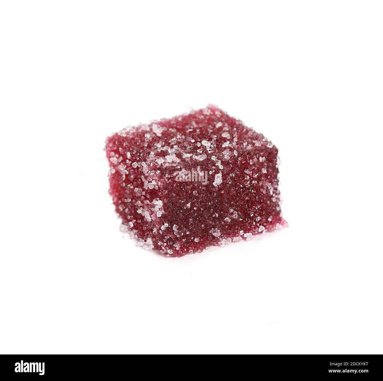 A red jelly cube covered with sugar isolated on a white background ...