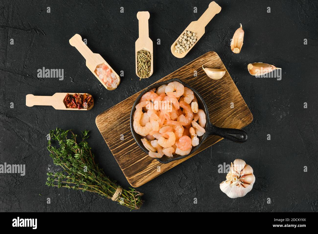 Overhead view of frozen peeled shrimps in frying pan Stock Photo - Alamy