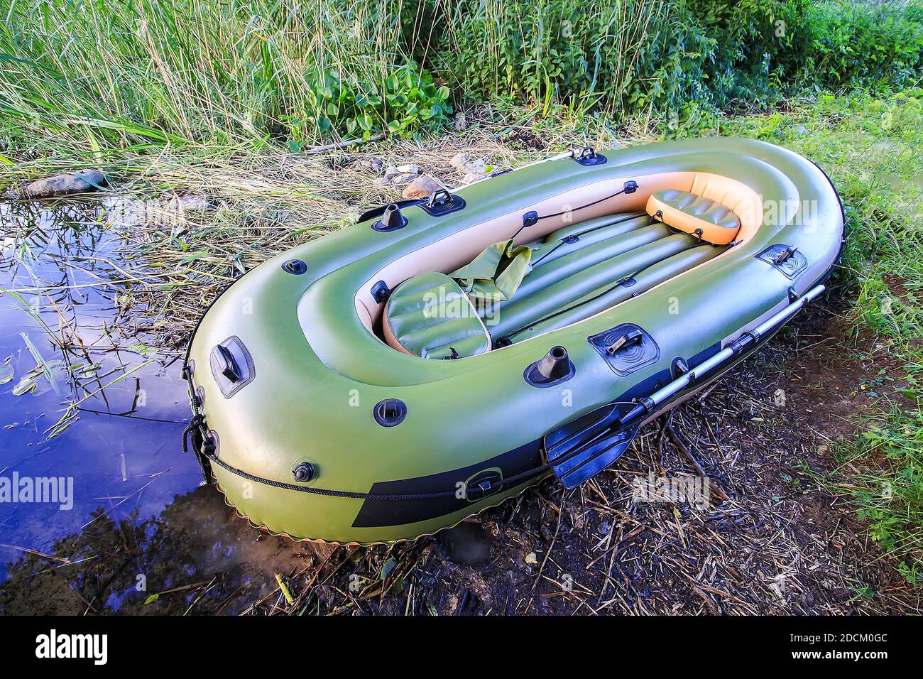 Inflatable boat near the rural lake Stock Photo - Alamy