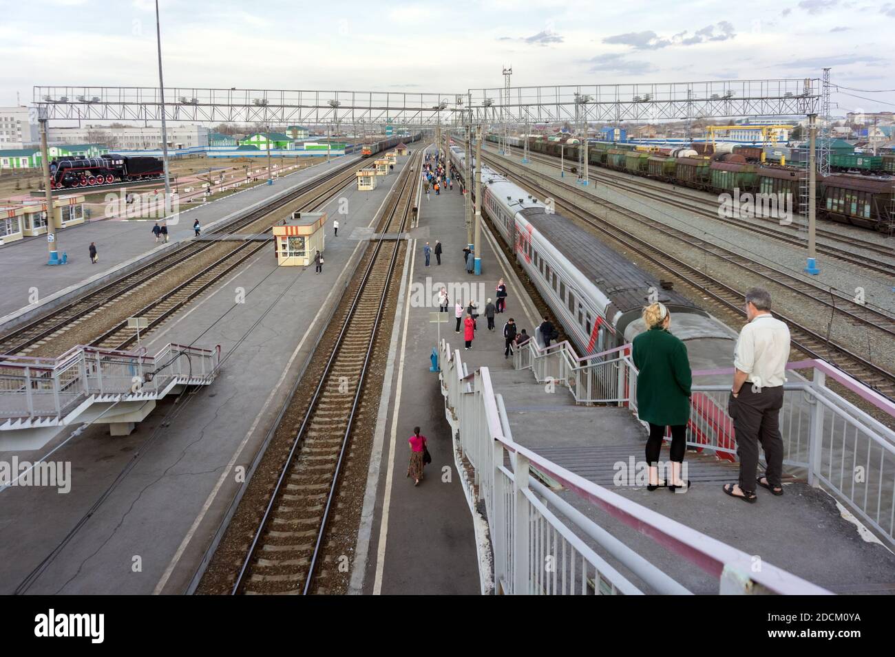 View from the rail-overroad bridge to the platform with a train and ...