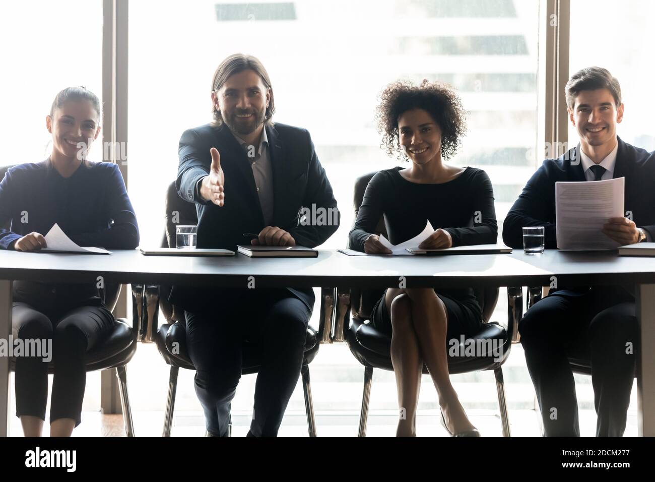 Portrait of smiling employers welcome applicants into team Stock Photo ...