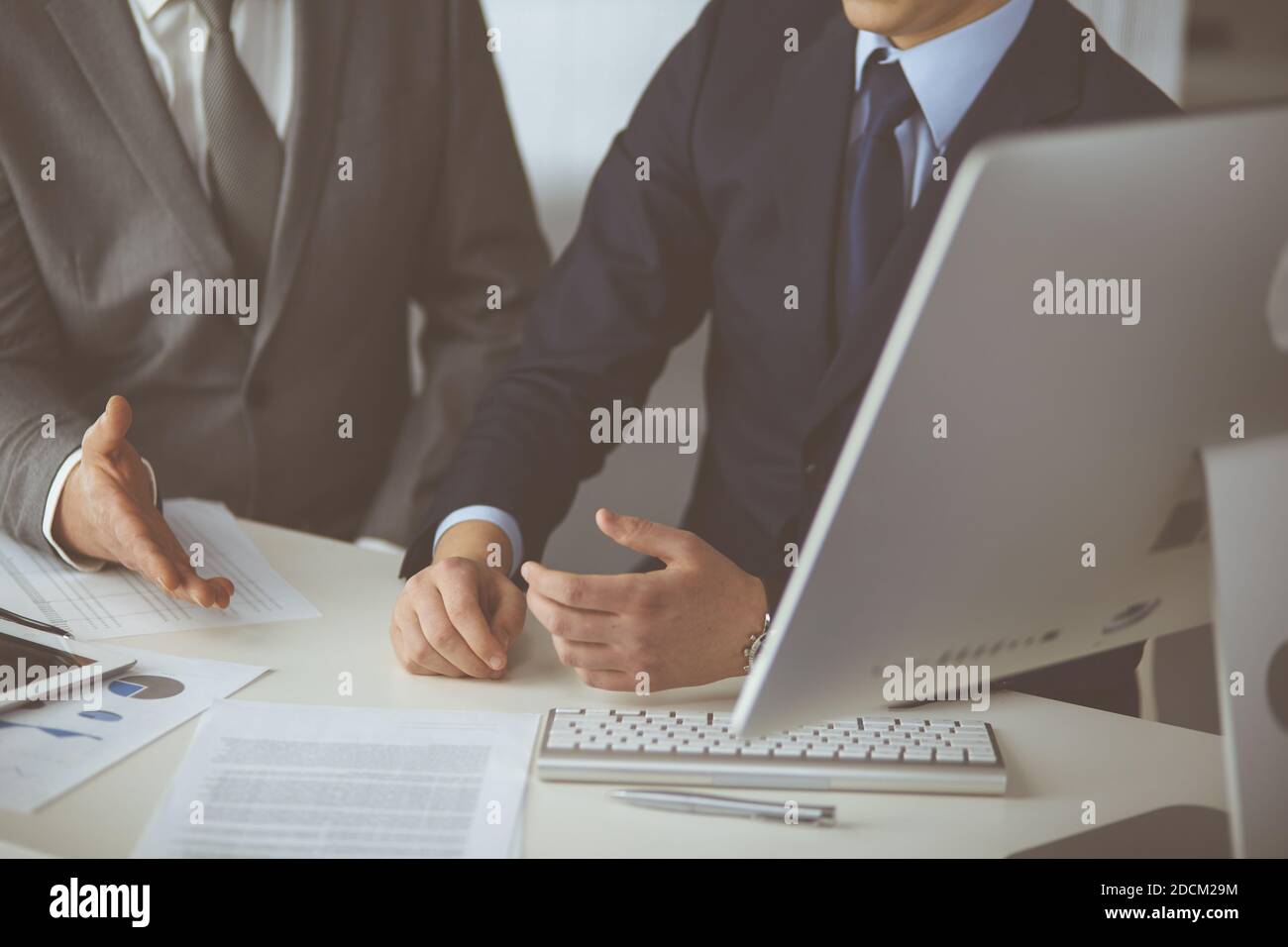 Business people using computer while working together in modern office ...