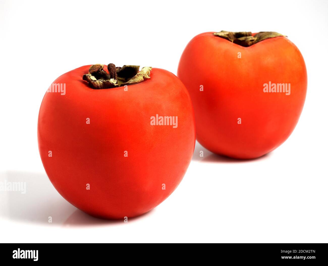 PERSIMMON FRUIT OR KAKI OR SHARON FRUIT diospyros kaki AGAINST WHITE ...