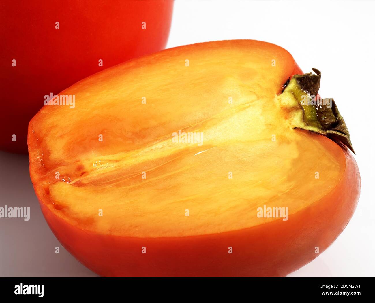 PERSIMMON FRUIT OR KAKI OR SHARON FRUIT diospyros kaki AGAINST WHITE ...
