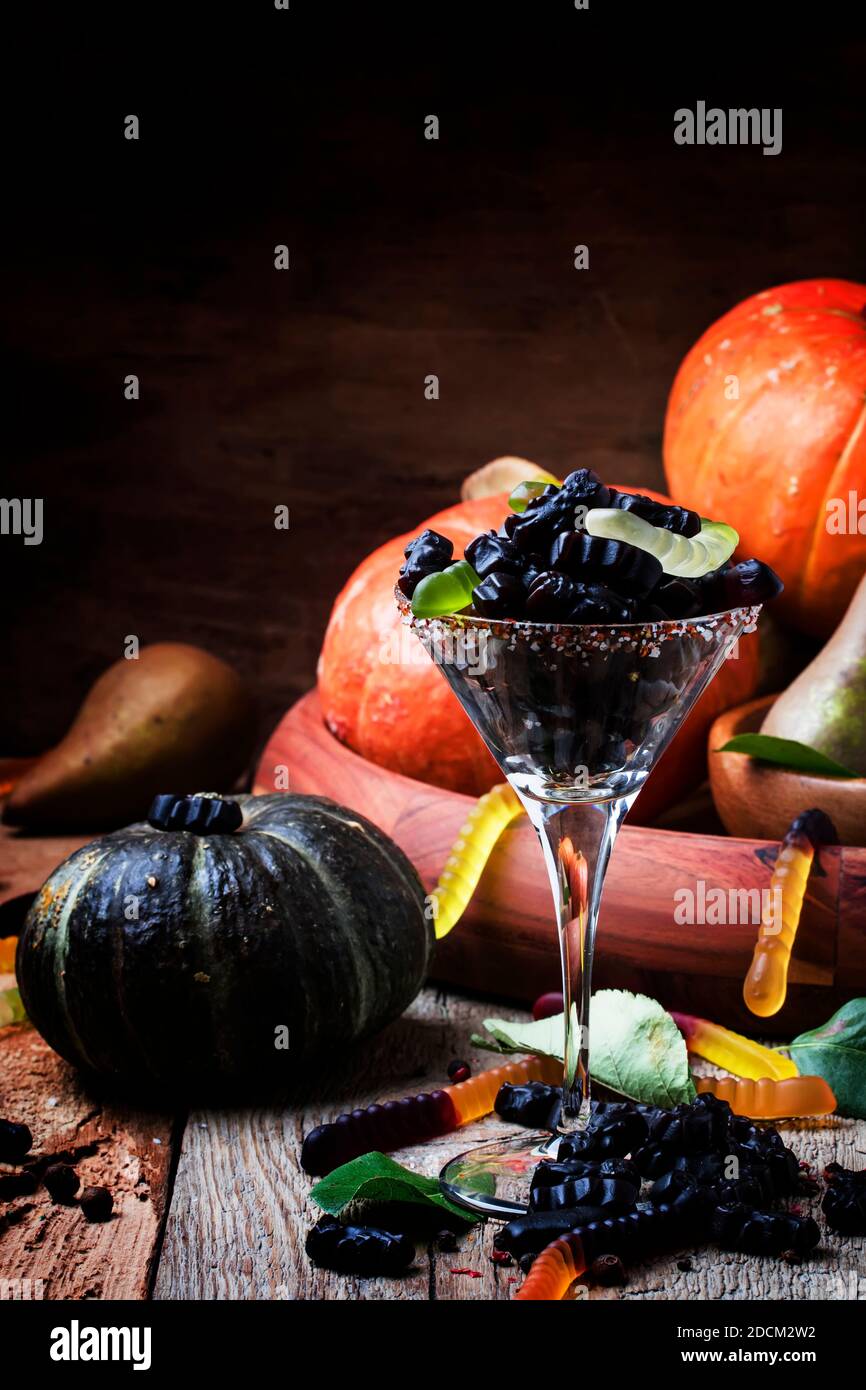 Halloween black candy and pumpkin guards ol old wooden background ...
