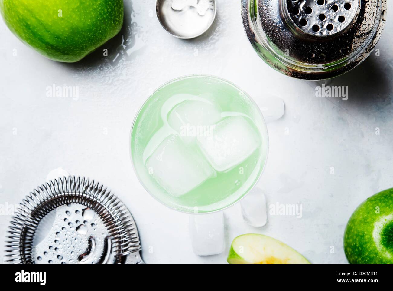 Alcoholic cocktail with green apple and dry vermouth, syrup, lemon ...