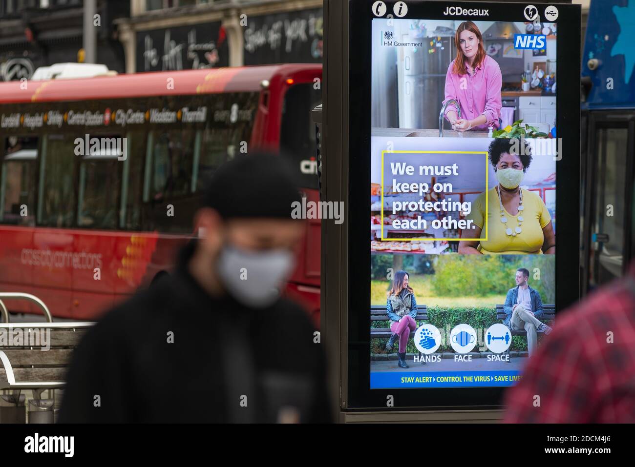 Southampton, UK, 21 Nov, 2020. People wearing masks walk past a NHS ...