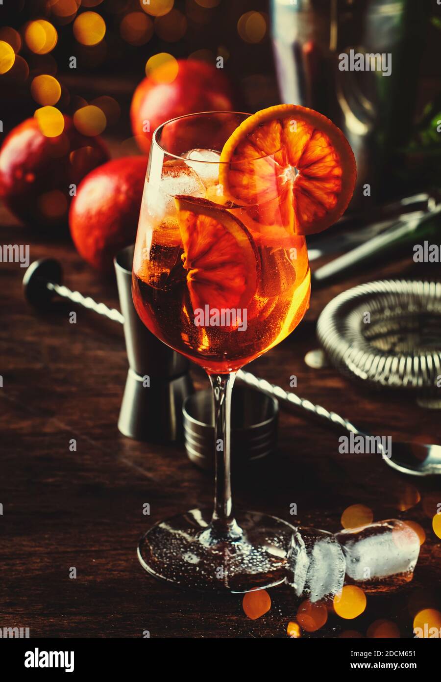 Aperol spritz cocktail in big wine glass with bloody oranges, summer ...