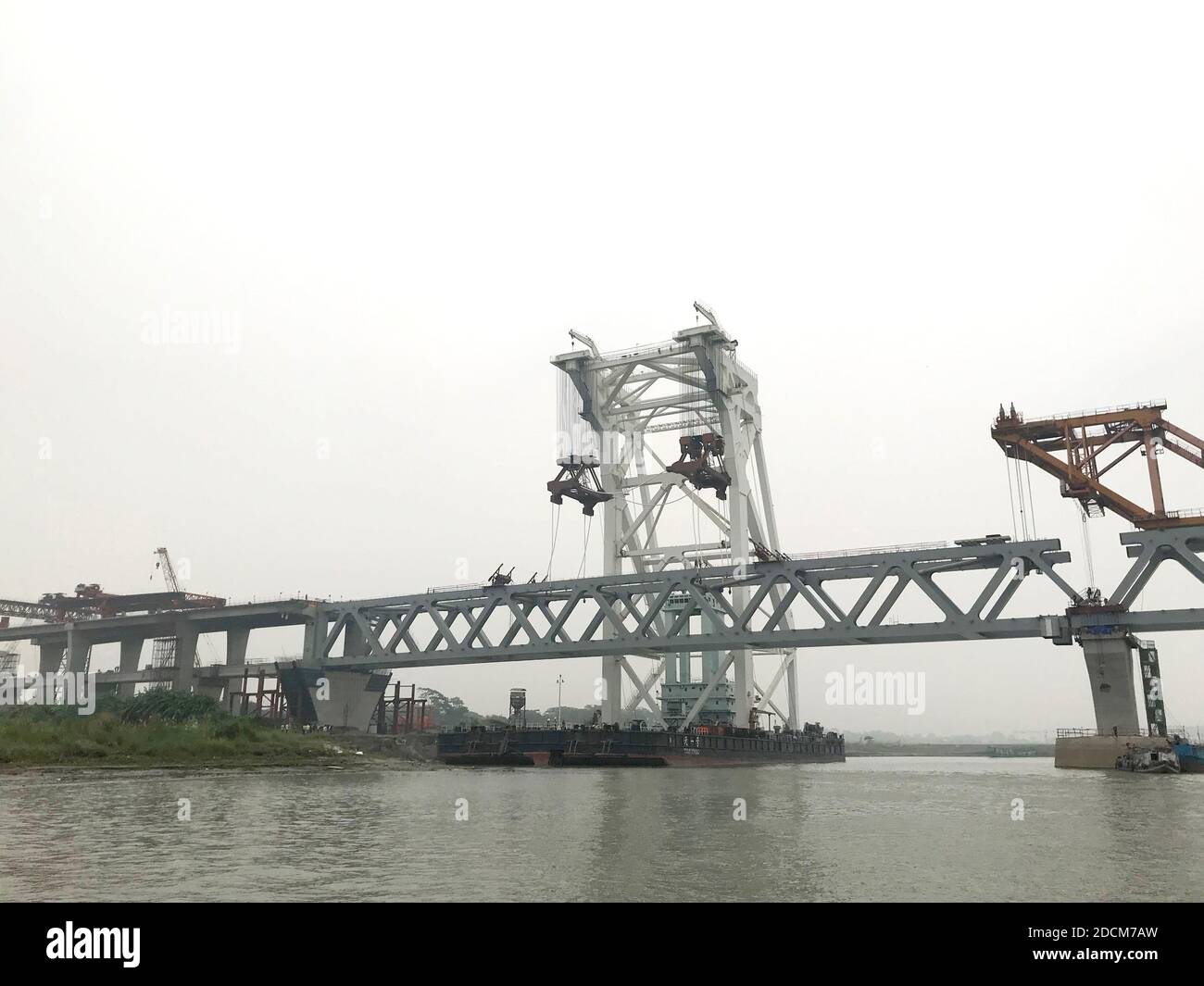 Munshiganj. 22nd Nov, 2020. A span is installed on pillars of the Padma ...