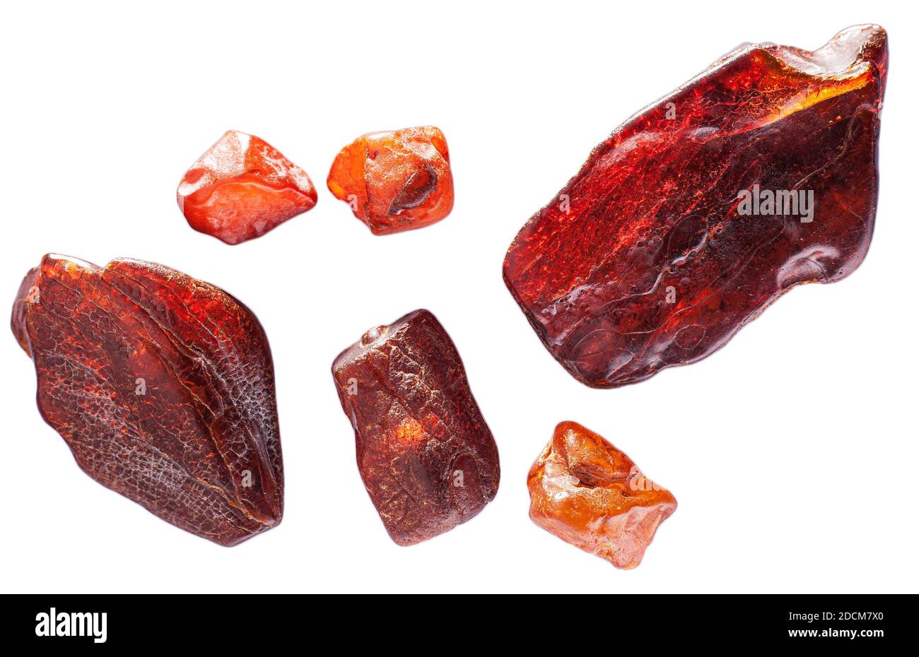 Raw amber stone or sun stone isolated on white background. A group of ...