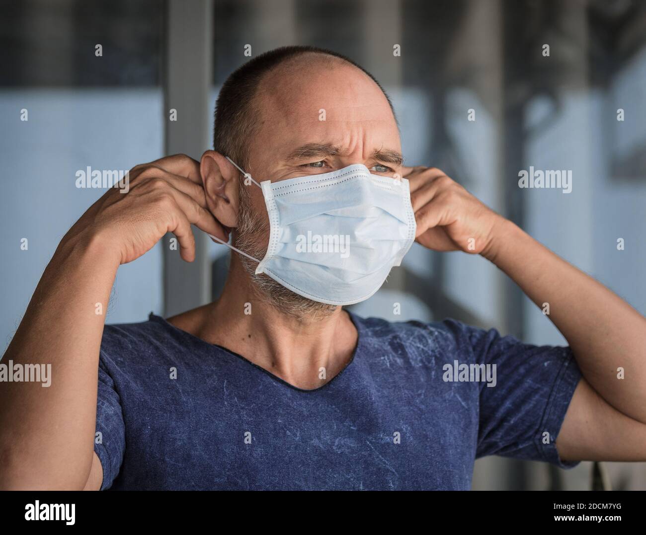 Man wearing facial disposable mask to avoid viral infection. Virus ...