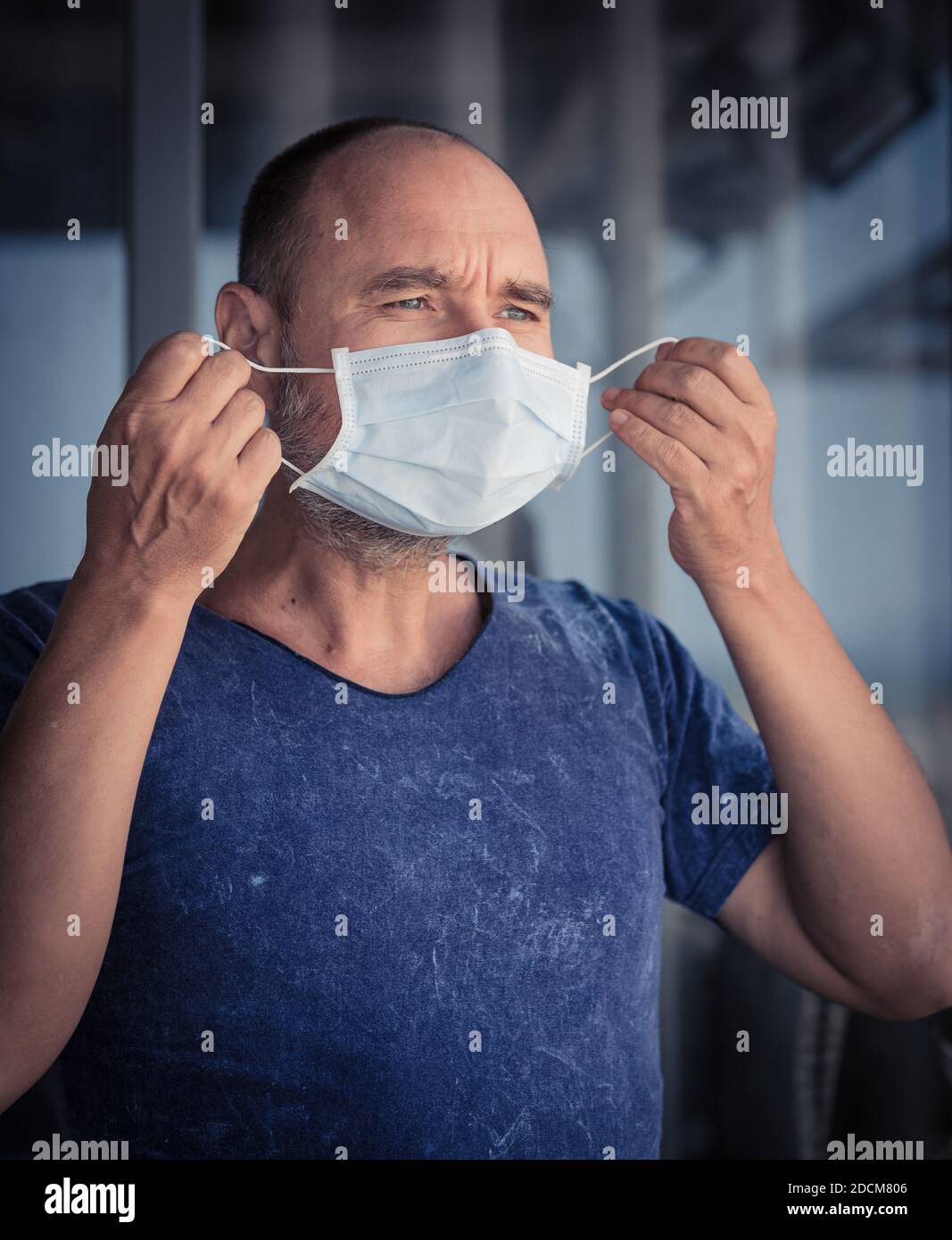 Man wearing facial disposable mask to avoid viral infection. Virus ...