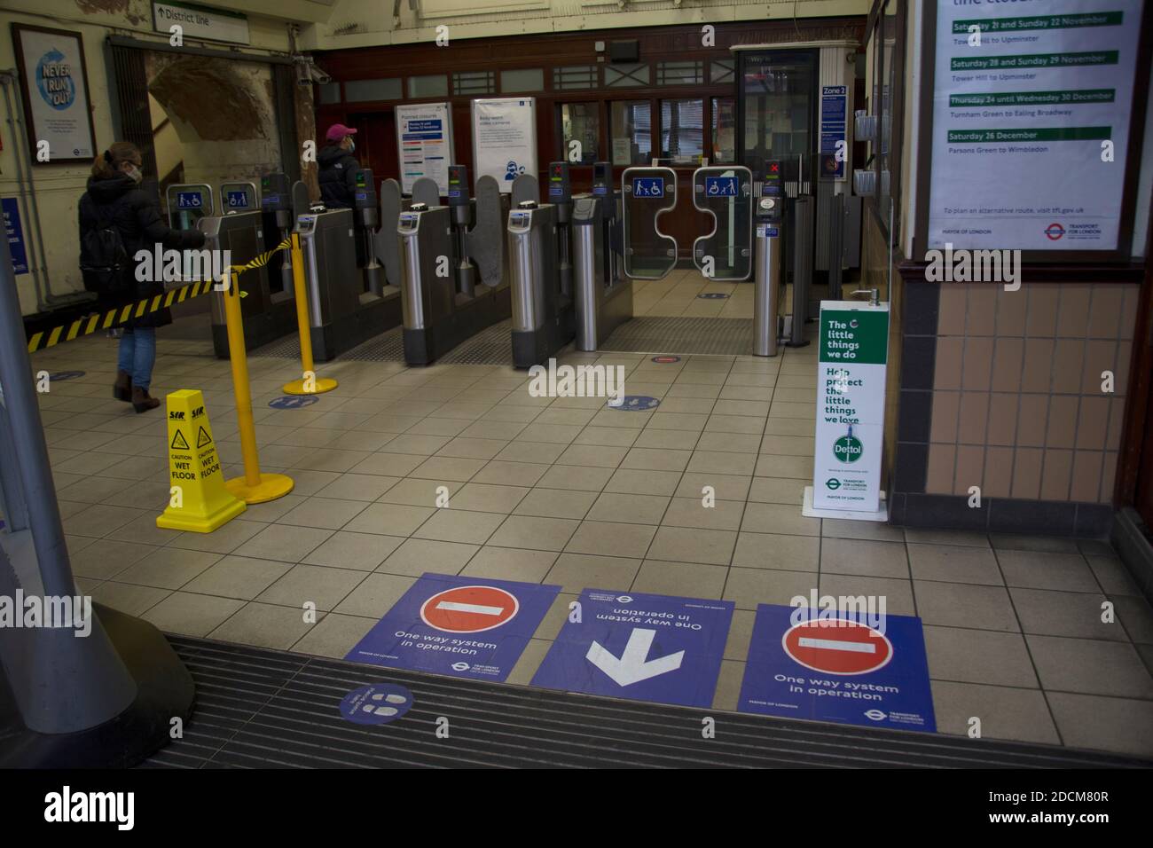 Putney Bridge Underground station with signs for social distancing ...