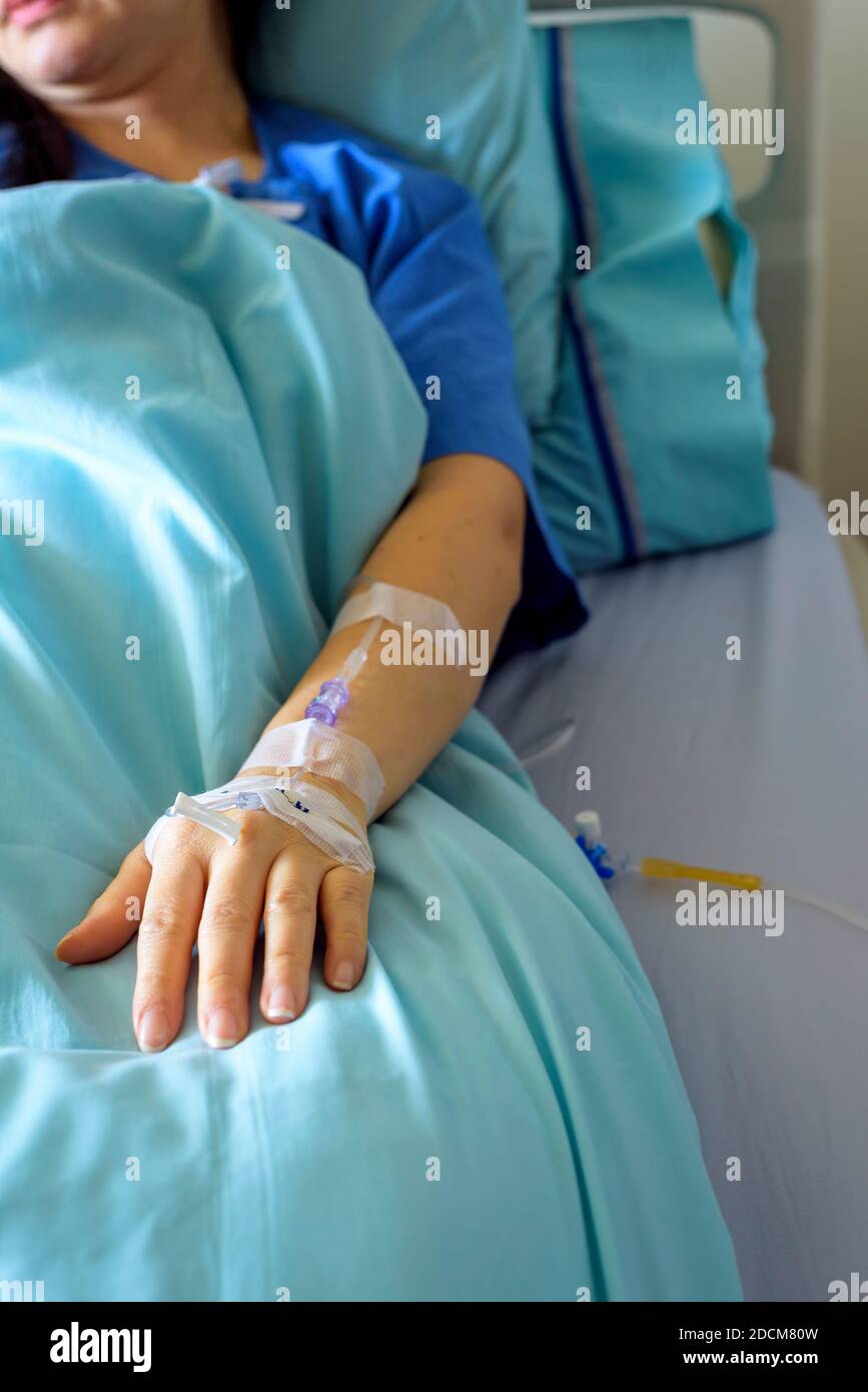 woman get a vi drip in patient's hand Stock Photo - Alamy