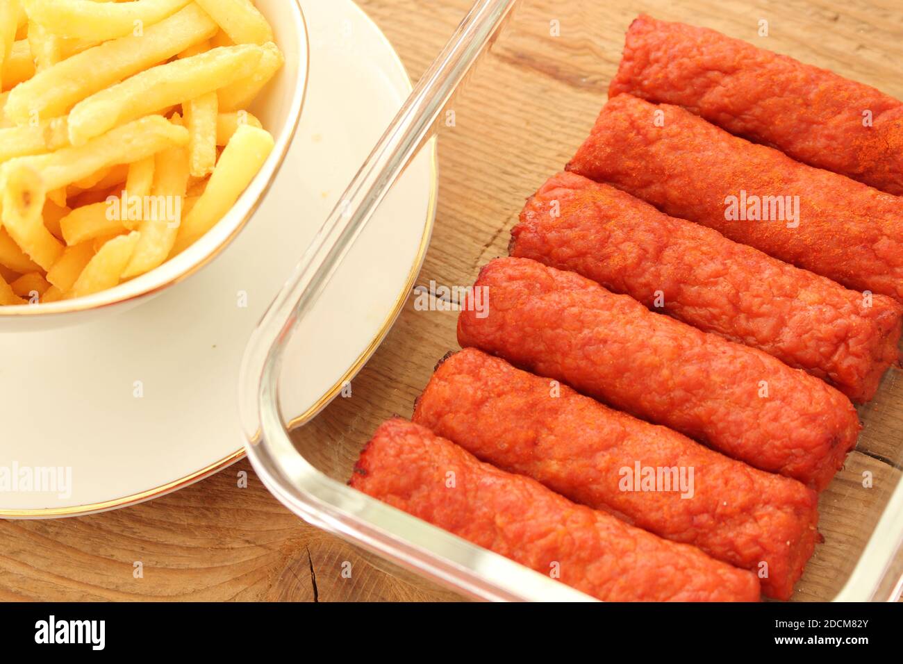 delicious french fries with cevapcici rolls and dip Stock Photo - Alamy