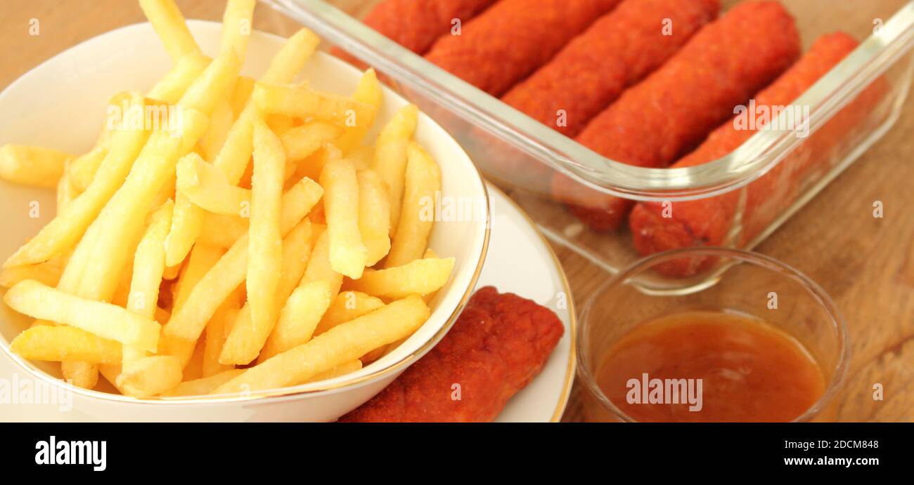 delicious french fries with cevapcici rolls and dip Stock Photo - Alamy