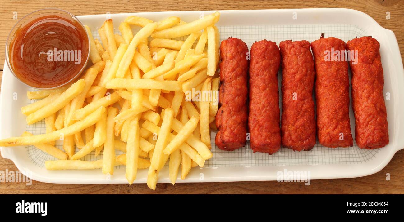 delicious french fries with cevapcici rolls and dip Stock Photo - Alamy
