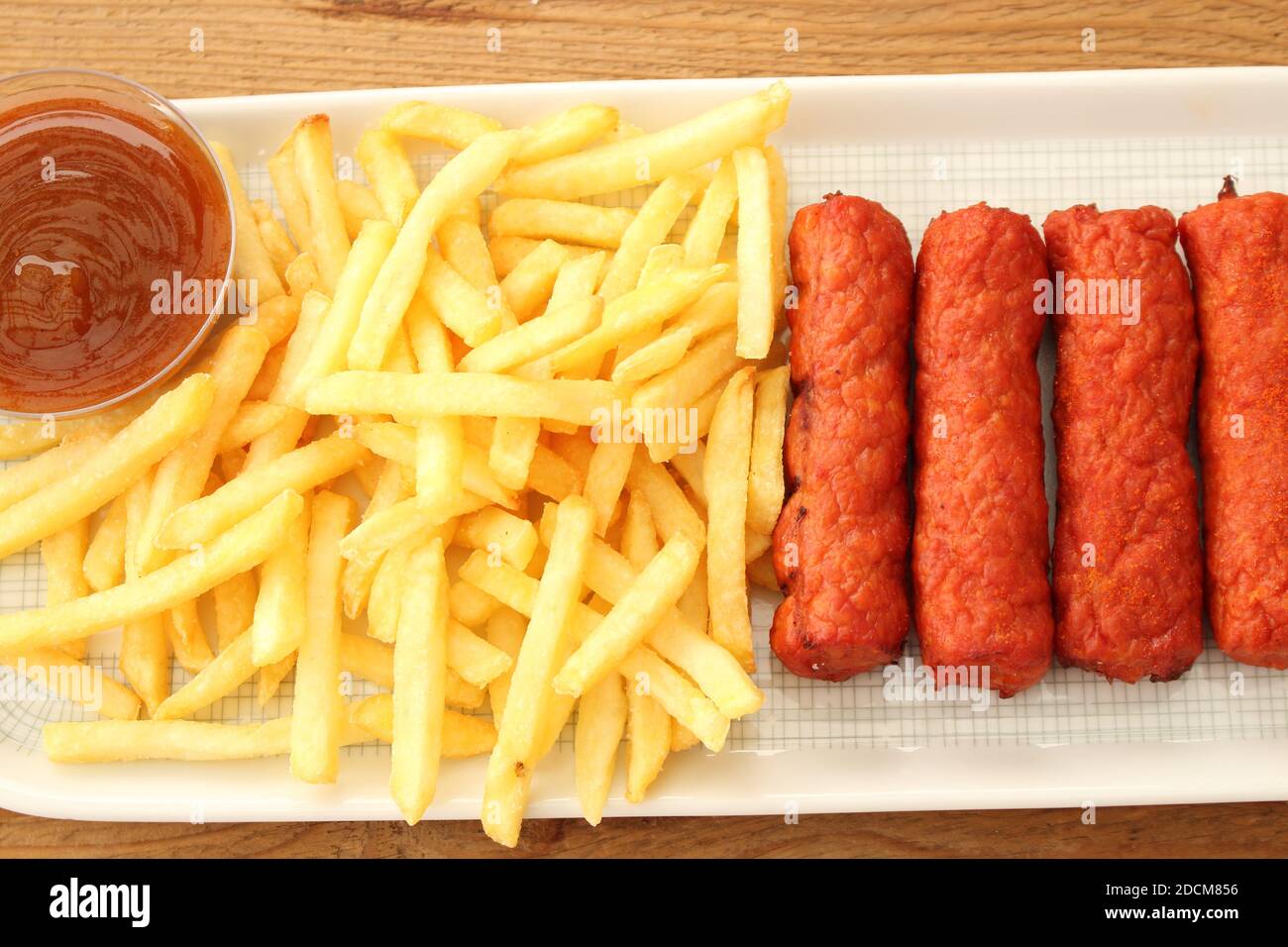 delicious french fries with cevapcici rolls and dip Stock Photo - Alamy