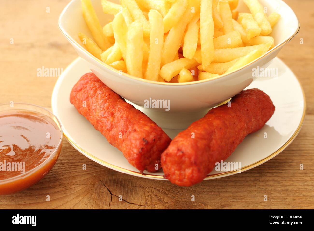 delicious french fries with cevapcici rolls and dip Stock Photo - Alamy