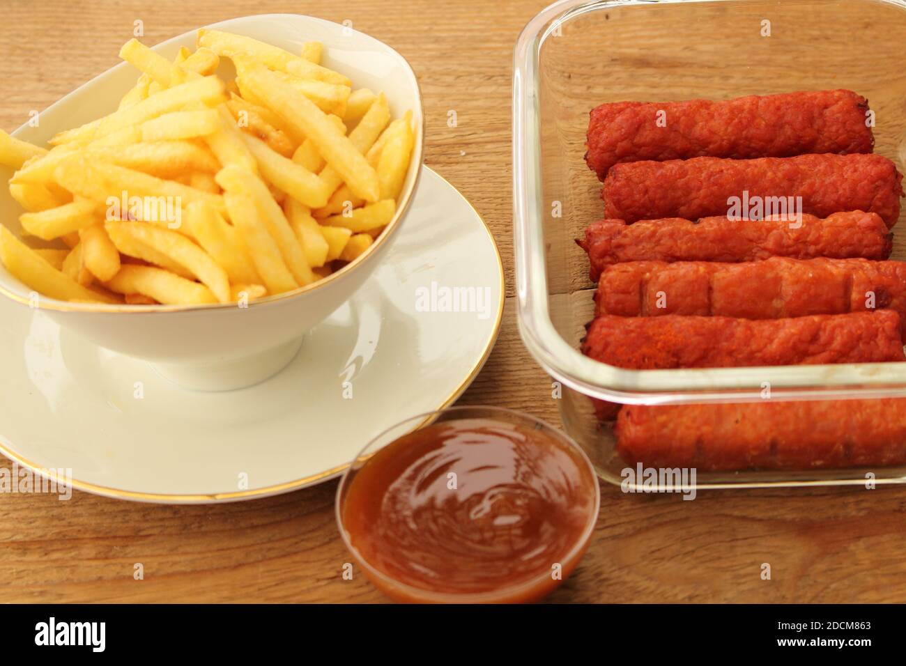 delicious french fries with cevapcici rolls and dip Stock Photo - Alamy