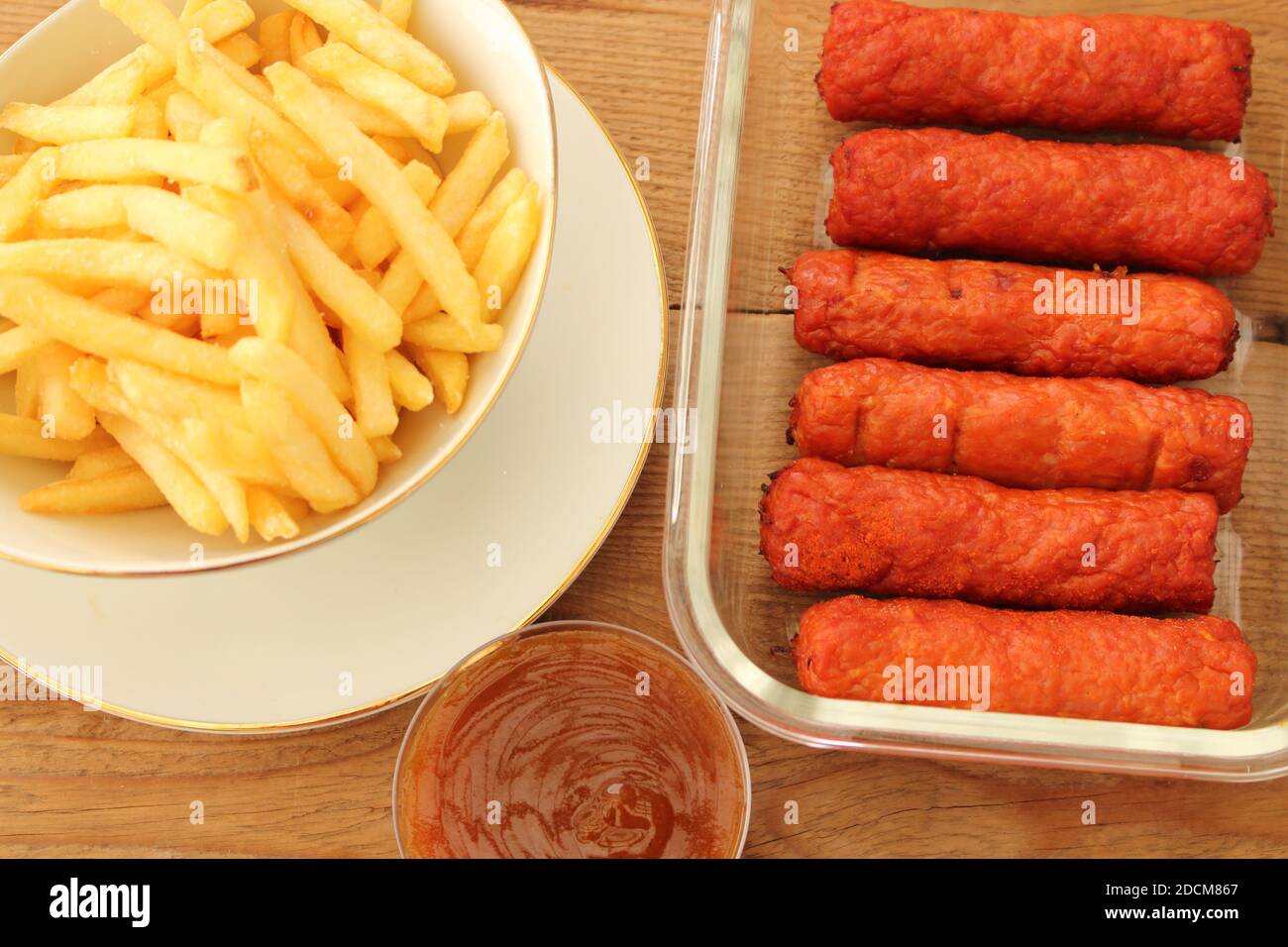 delicious french fries with cevapcici rolls and dip Stock Photo - Alamy
