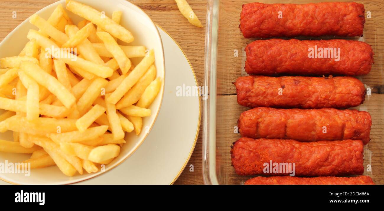 delicious french fries with cevapcici rolls and dip Stock Photo - Alamy