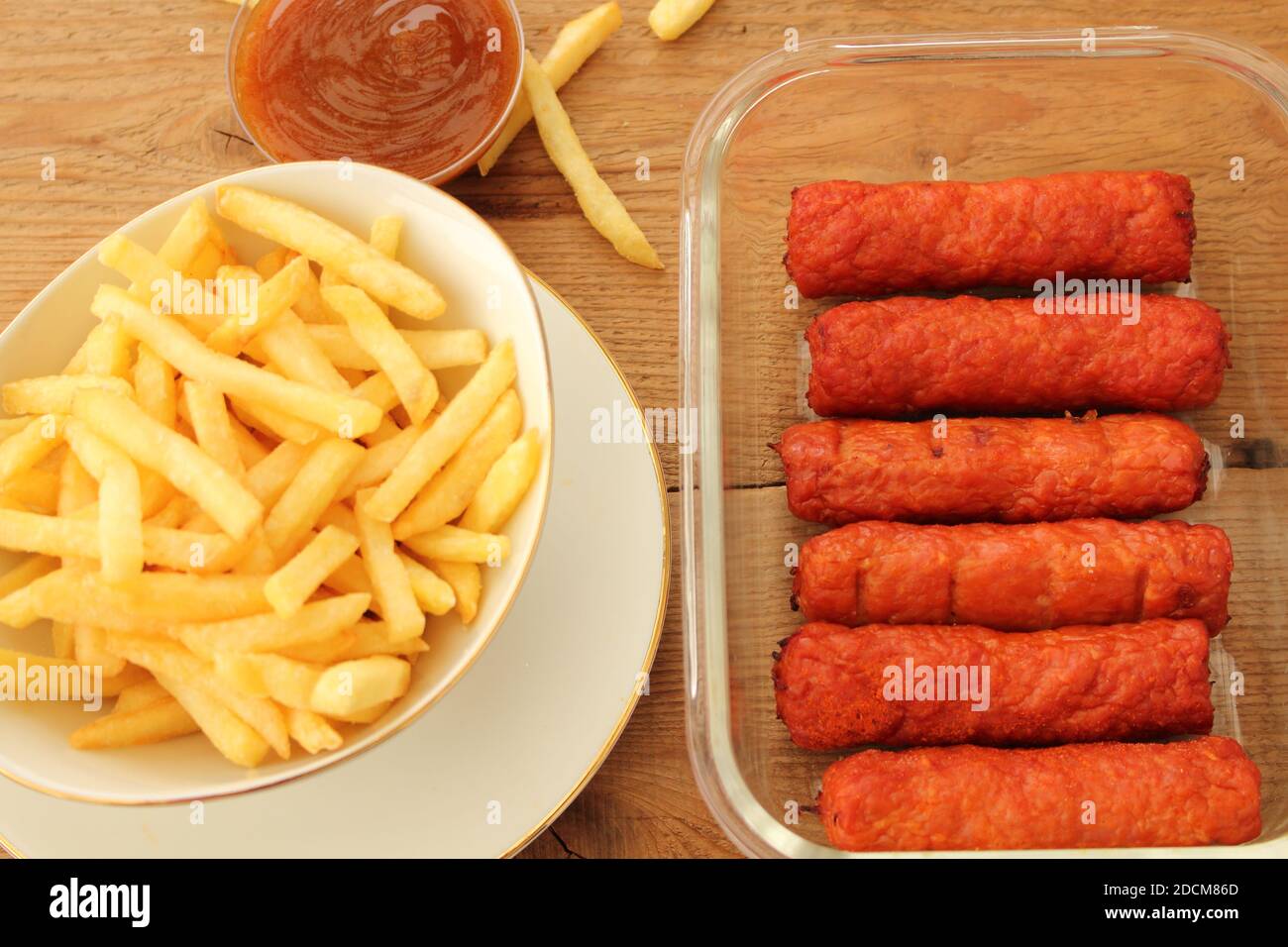 delicious french fries with cevapcici rolls and dip Stock Photo - Alamy